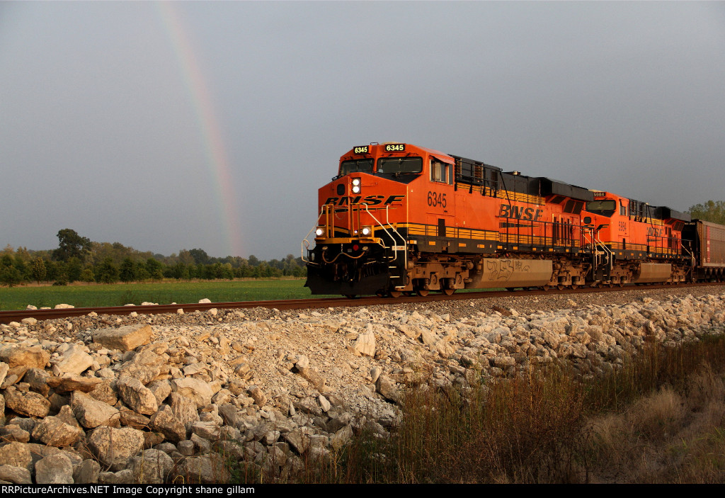 BNSF 6345 takes charge on this NB out of the storm to find a rainbow.